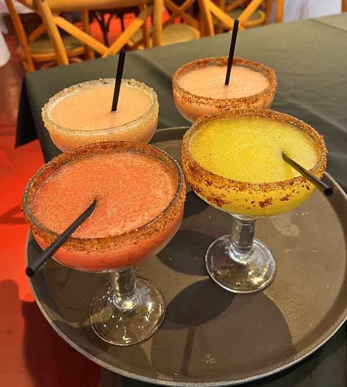 Frozen margaritas in cheerful colors, rimmed with sugar and ready to make brunch feel like vacation mode.