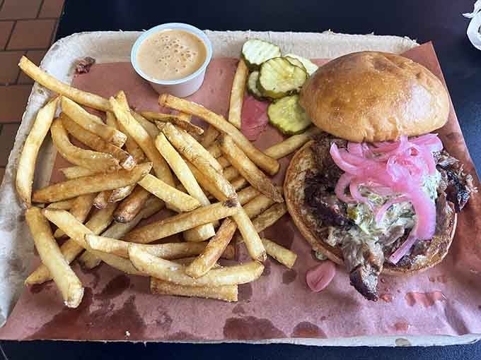 A brisket sandwich this loaded requires both hands, several napkins, and zero regrets about your choices.