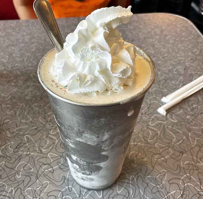 Topped with whipped cream and served in classic diner style, this shake requires commitment and upper arm strength.