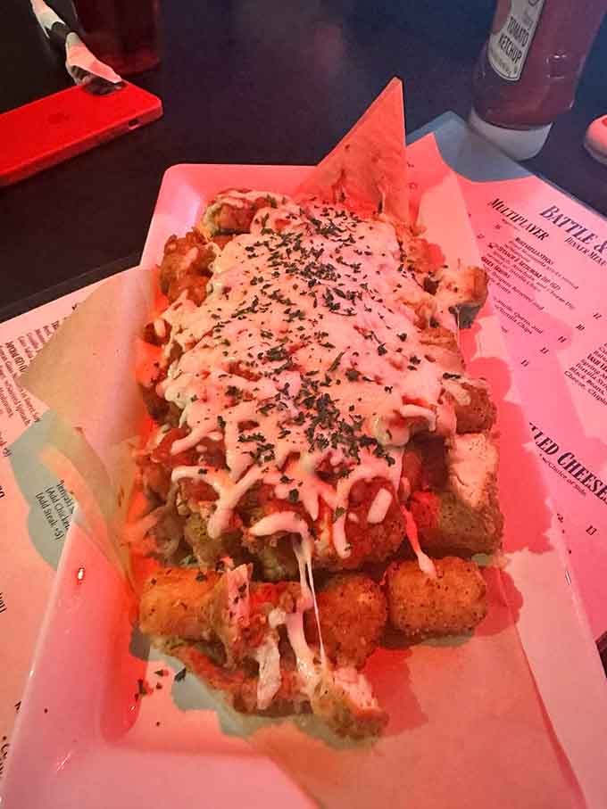 Chicken Parmesan tots are basically Italian comfort food in portable form, drizzled with sauce and melted cheese.