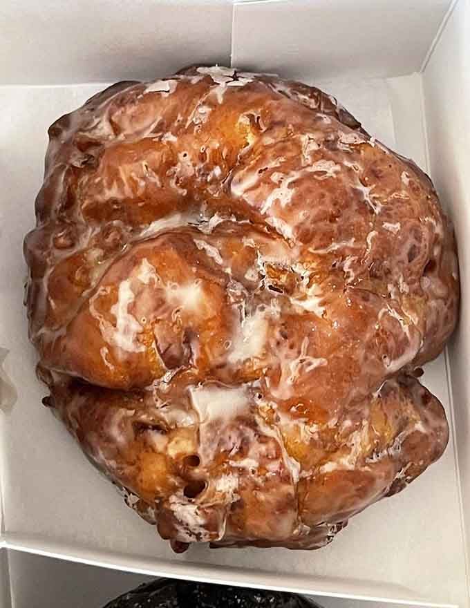 The apple fritter that launched a thousand return visits, golden and glistening like treasure from a bakery pirate.