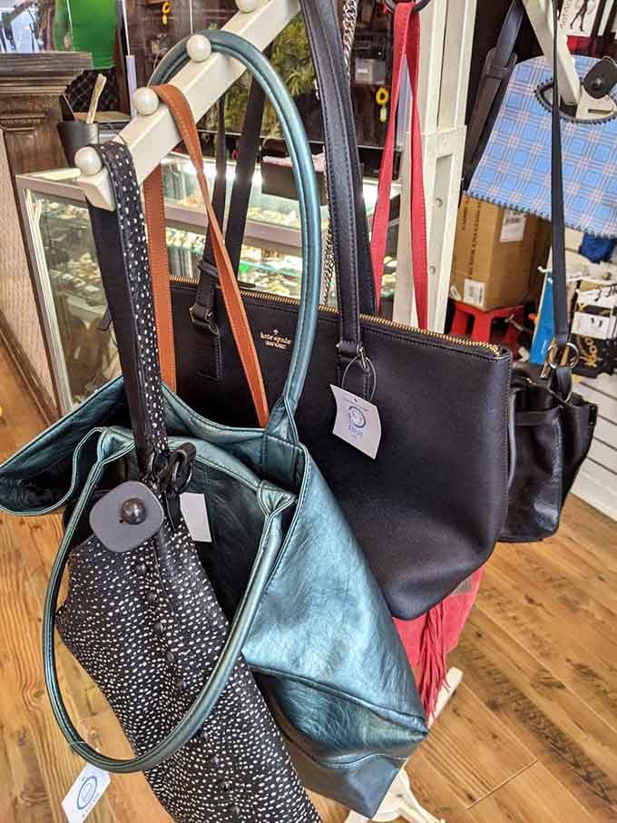 Designer bags hanging like art in a gallery, except these masterpieces won't require a second mortgage to own.