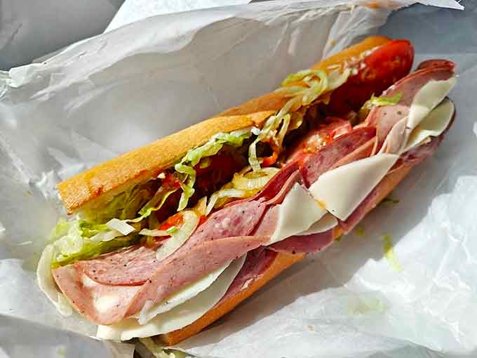 Cold cuts piled high with fresh vegetables create a flavor symphony that sings in perfect deli harmony.