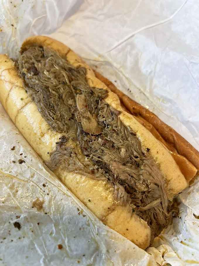 Slow-roasted pork on French bread delivers the kind of flavor that makes you understand why people write poetry about food.