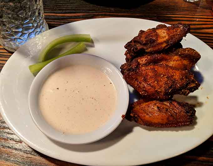 Crispy wings with celery and ranch, the holy trinity of bar food that never goes out of style anywhere.