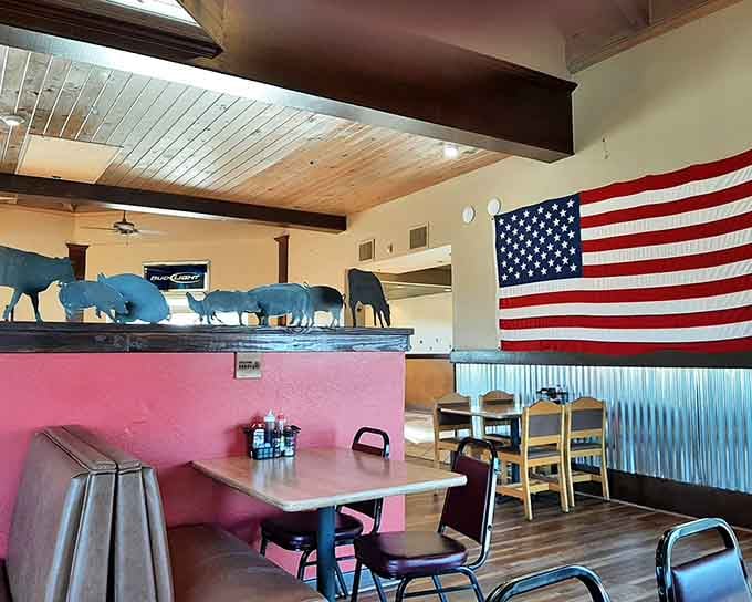 The American flag and pig silhouettes tell you everything about this place's priorities: patriotism, pork, and good times.