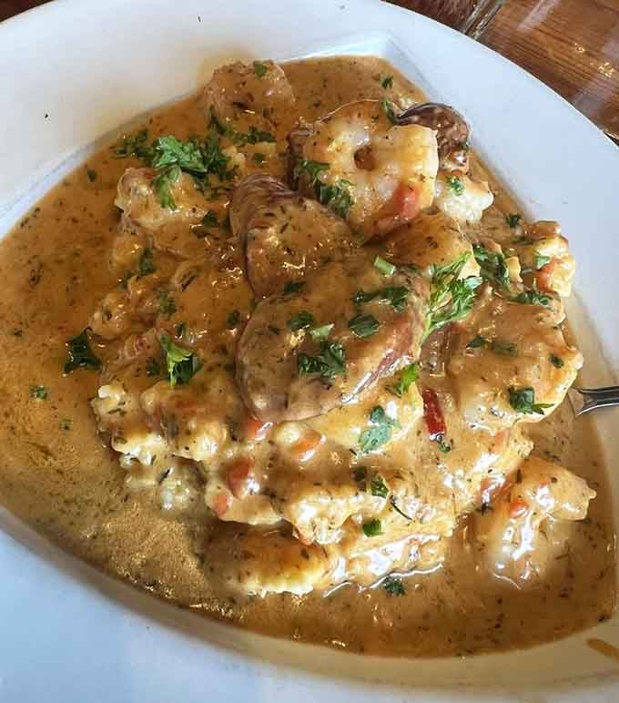 Shrimp and grits swimming in creamy sauce is Southern cooking at its soul-satisfying, butter-loving best here.