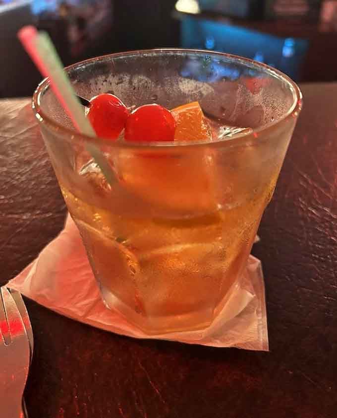 A proper Wisconsin Old Fashioned, complete with cherries and an orange slice, ready to start your evening right.