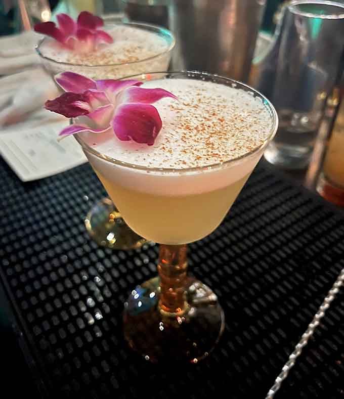 Orchid-garnished cocktails served in vintage glassware make you feel fancy even if you arrived wearing sneakers and jeans.