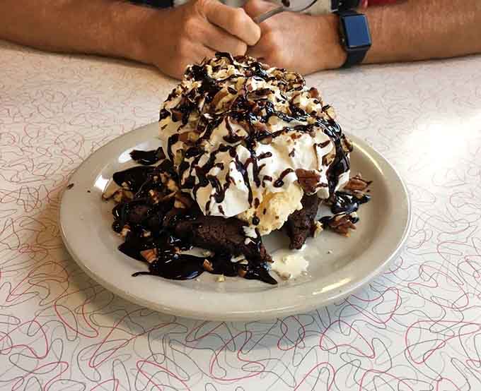This brownie sundae mountain requires both commitment and possibly a nap afterward, but it's absolutely worth it.
