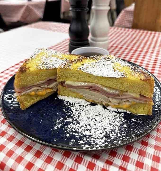 Dusted with powdered sugar, this Monte Cristo delivers sweet and savory layers that'll have you planning your return visit.