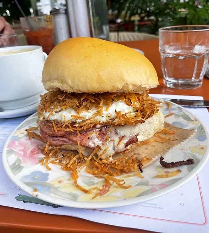 That breakfast sandwich with crispy hash browns is basically a hug you can eat with your hands.