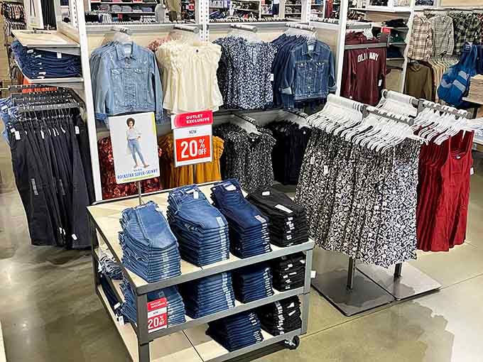 Denim stacked like blue gold alongside floral prints and classic pieces, organized chaos that somehow makes perfect sense to bargain hunters.