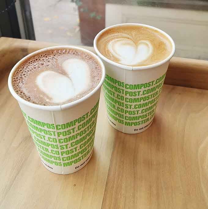 Compostable cups with heart-topped lattes, because even the coffee here gets the artisan treatment it deserves.