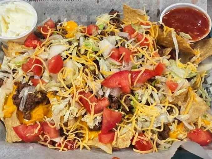 Loaded nachos piled high with all the fixings prove that sometimes more really is more, especially with cheese.