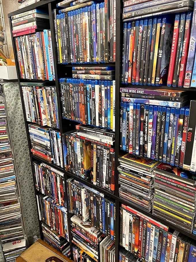 DVDs and media stacked floor to ceiling, a pre-streaming paradise for anyone who misses actually owning their movies.