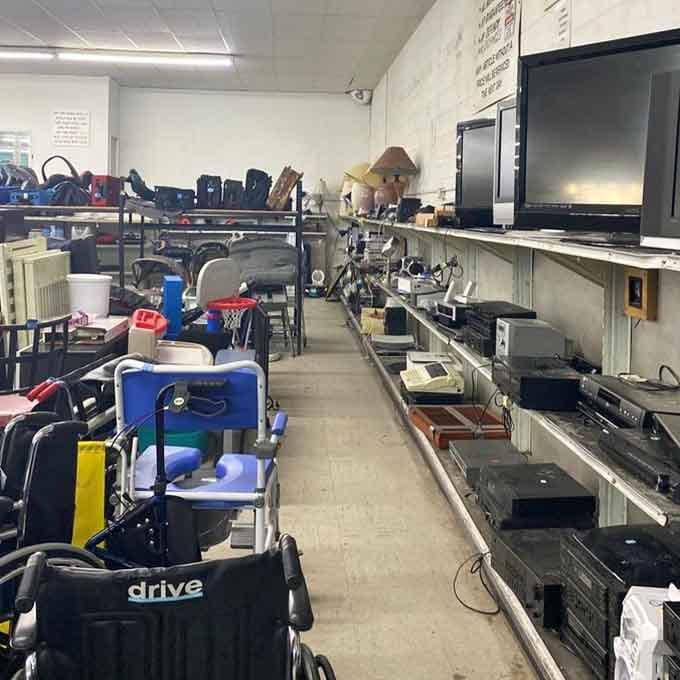 Shelves packed with electronics from various eras offer functional tech without the new-in-box price tag shock.