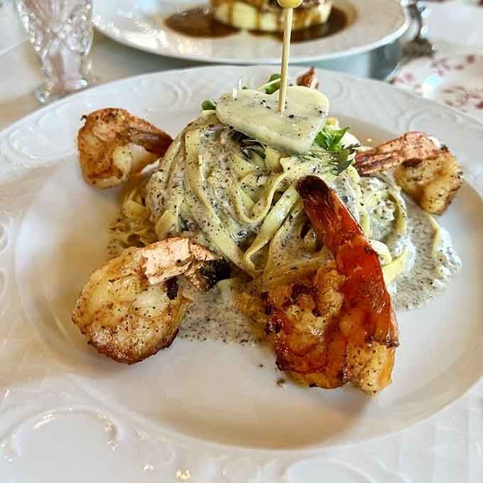 Truffle pasta wrapped around grilled shrimp like it's giving the seafood a fancy French hug with Italian flair.