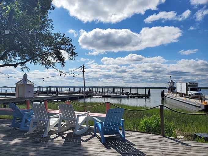 Colorful Adirondack chairs await at the marina, the perfect spot for watching boats drift by and worries drift away.