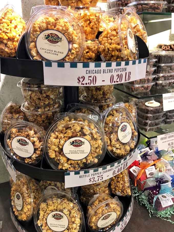 Chicago blend popcorn stacked high in clear containers shows off that addictive combination of caramel and cheese in golden perfection.
