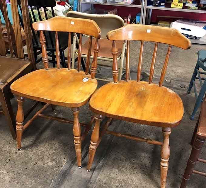 Classic wooden chairs with character and spindles, ready to anchor your dining room or reading nook.