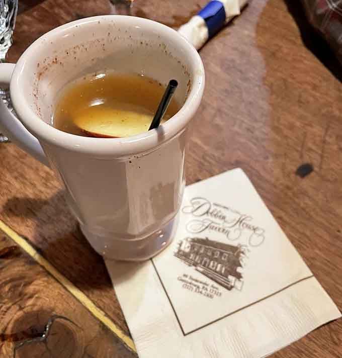 Hot cider served in a proper mug, warming you from the inside out like grandma intended.