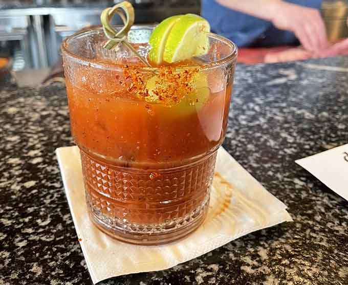 A Bloody Mary garnished with enough personality to qualify as both beverage and appetizer in one glass.