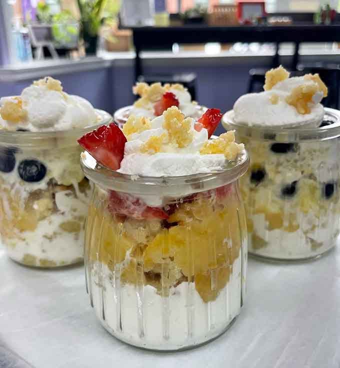 Layered jar cakes topped with whipped cream and fresh berries, because sometimes pie needs a little friendly competition.