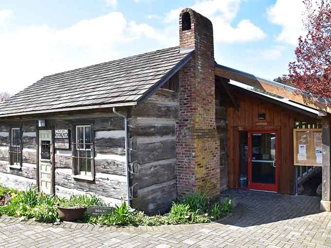 The Historical Museum's log cabin exterior whispers stories of island life before Wi-Fi ruined everything we loved.