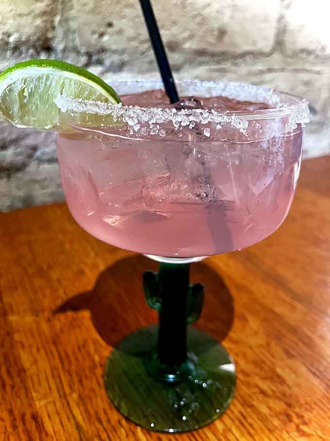 A prickly pear margarita in a cactus-shaped glass, because sometimes Arizona likes to show off a little.
