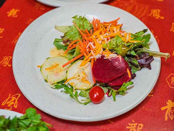 Even the salad looks like it's trying to impress, colorful and fresh enough to ease buffet guilt.
