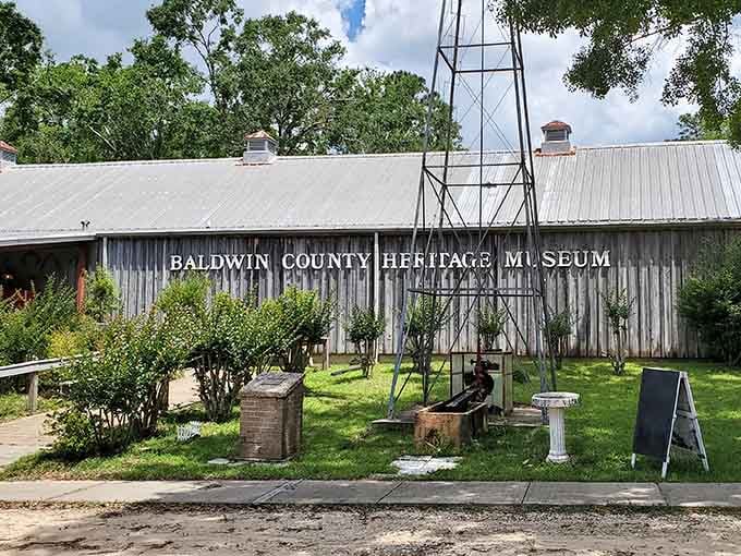 Weathered tin siding holds decades of local stories, each artifact inside whispering tales of Baldwin County's colorful past.