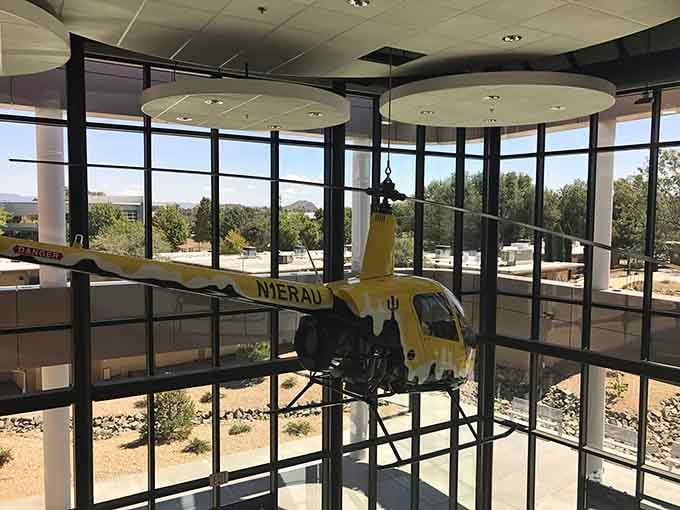 A yellow helicopter suspended in the atrium proves that some aircraft are too cool to stay grounded.