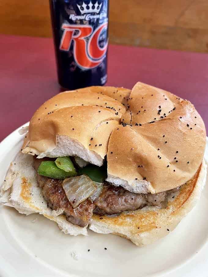 This sausage sandwich on a hard roll shows the kitchen's range extends beyond their famous minis, though let's be honest about why you're really here.