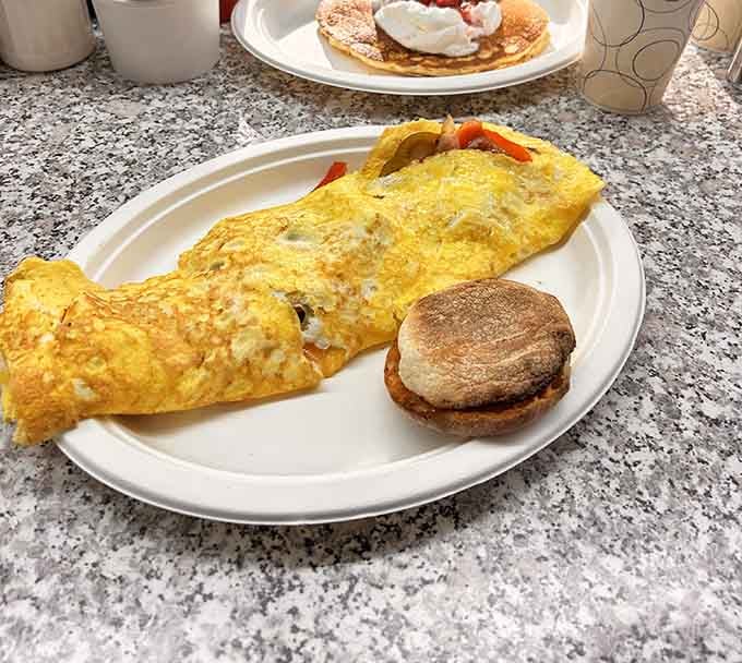 That omelet is fluffy enough to use as a pillow, if pillows were delicious and filled with cheese.