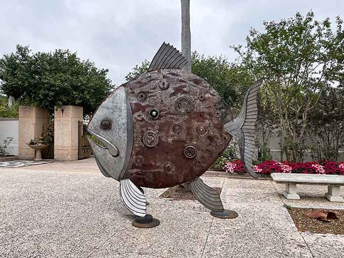 This quirky metal fish sculpture adds unexpected charm, proving gardens have a sense of humor too.