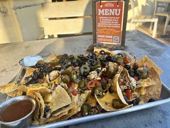 Nachos piled high with jalape&ntilde;os and all the fixings&mdash;perfect for sharing, unless the ghosts get hungry too.