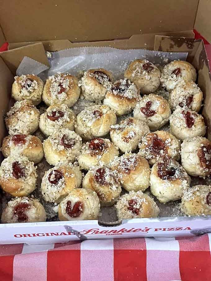 Little dough pockets of happiness, dusted with cheese and ready to disappear faster than your diet resolutions.