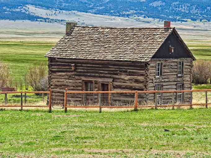 This weathered log cabin stands as a testament to the grit of frontier life in the valley.