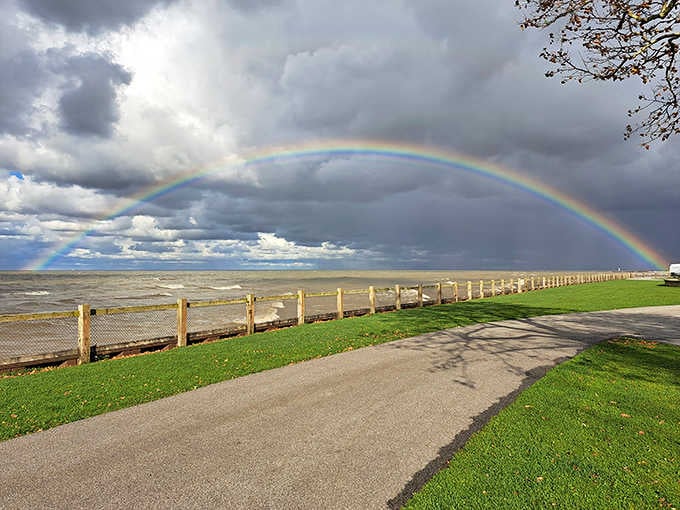 That double rainbow arching over the lake is nature showing off, and honestly, we're not complaining one bit.