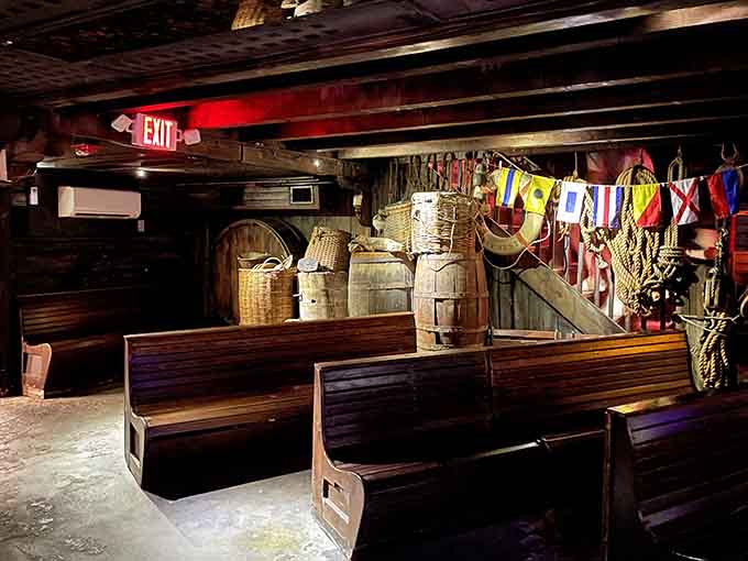 Wooden benches and maritime relics create an atmosphere that feels authentically vintage, not theme-park manufactured.
