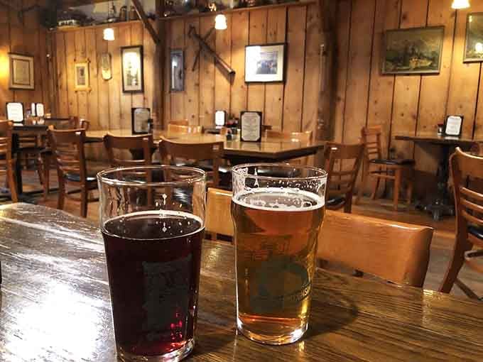 Two perfectly poured beers waiting on a wooden table, the international language of relaxation spoken fluently here.