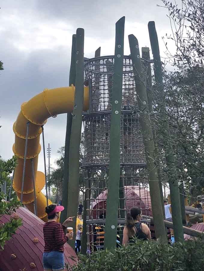 The yellow tube slide spirals down from impressive heights, delivering thrills faster than you can say "hold on tight!"