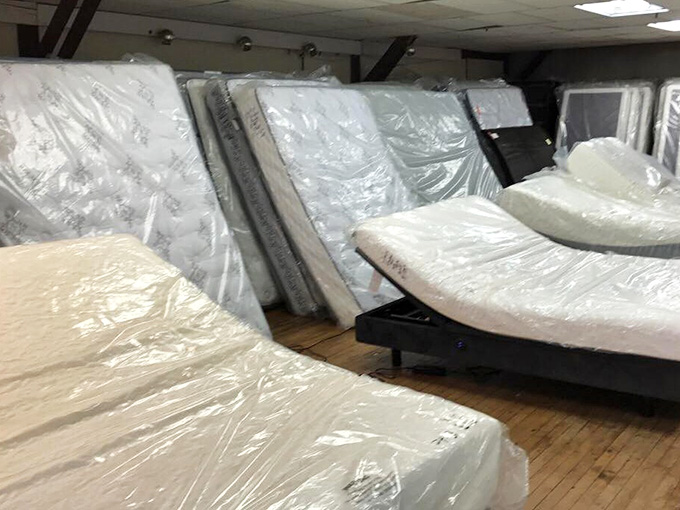 Mattresses wrapped pristine and waiting, promising sweet dreams without the nightmare of retail markups.