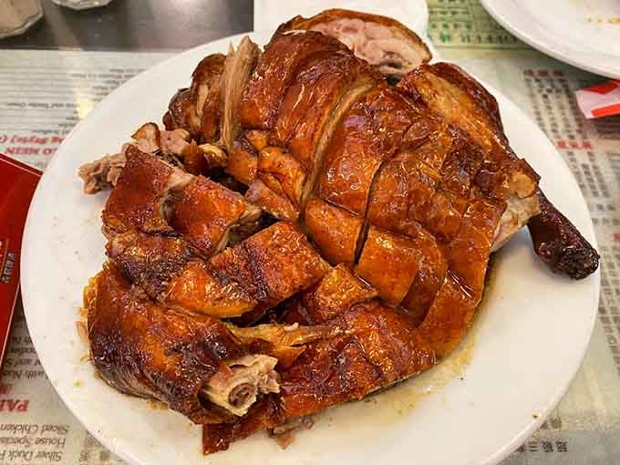 A whole Peking duck that looks like it just won a beauty pageant, and tastes even better.