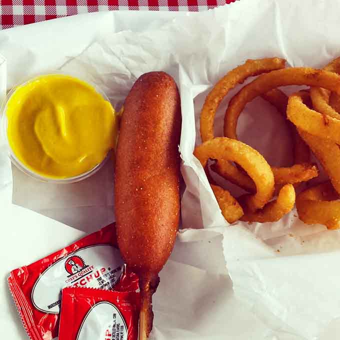 That corn dog and onion rings combo proves this place knows its way around classic American drive-in fare.
