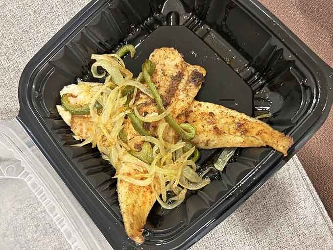 Grilled whitefish topped with caramelized onions and peppers delivers simple perfection on a plate.