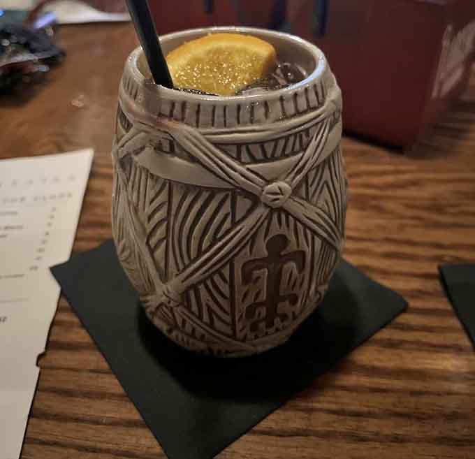 That ornate tiki mug holds tropical escape vibes that transport you far beyond Connecticut's borders with every sip.