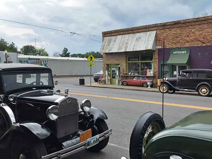 Classic cars parked on Main Street aren't show-offs here; they're just fitting in with the general vintage vibe of everything.