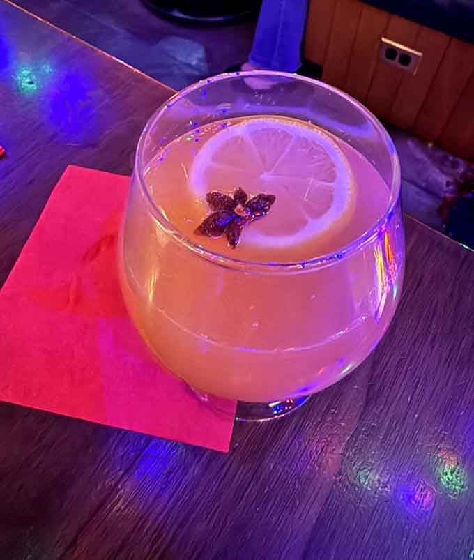 Cocktails here glow like they've absorbed the tropical energy radiating from every hanging plant nearby.